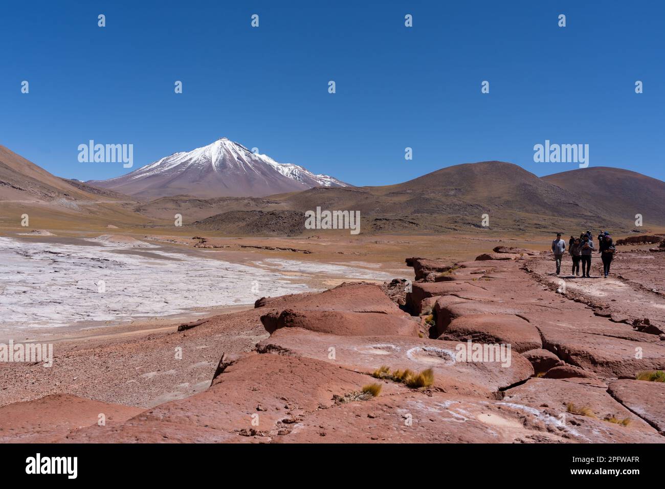 Red Rocks (Piedras Rojas), lagoon and salt flats with unrecognizable ...