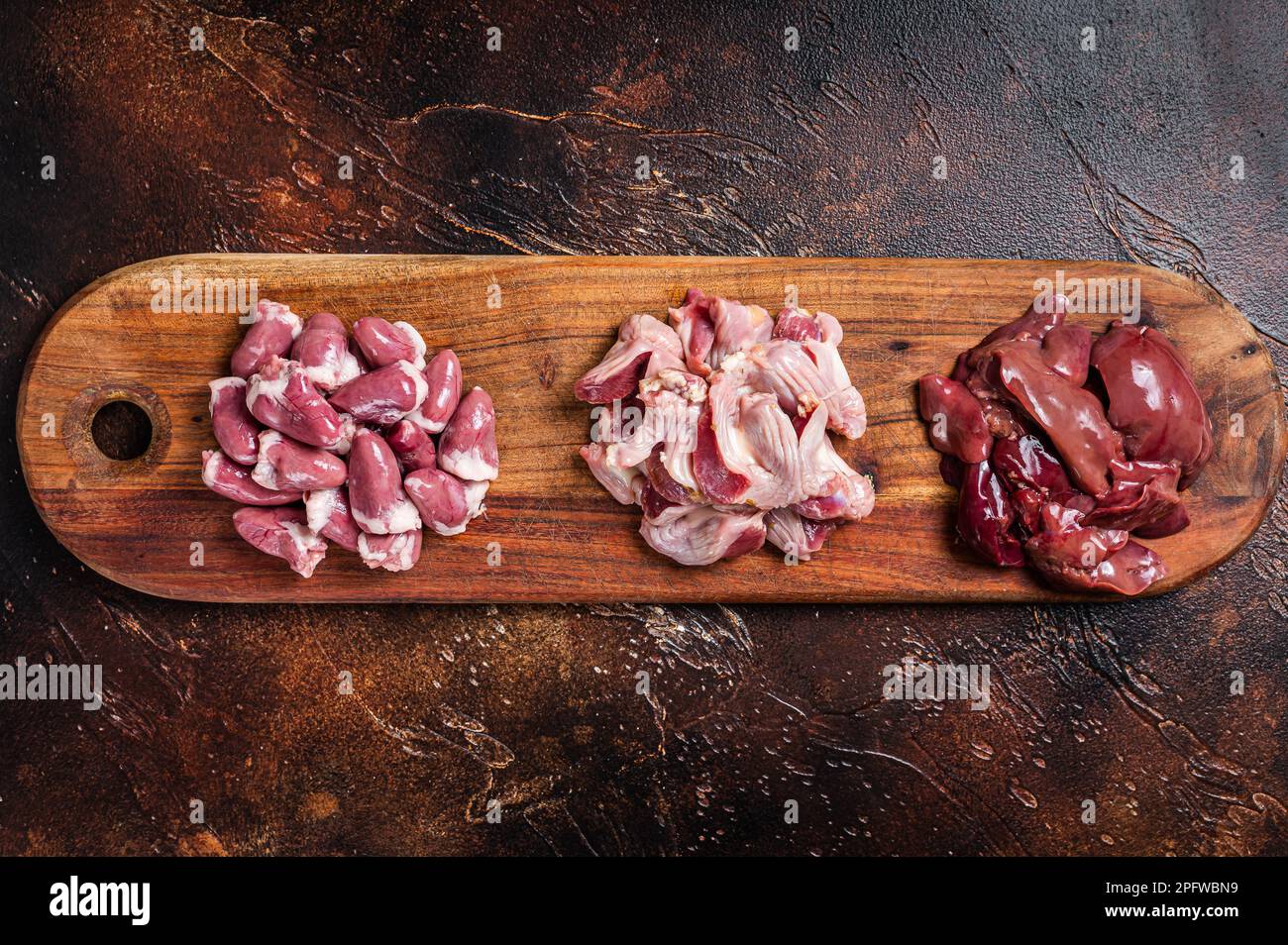 Raw chicken offals, liver, hearts, gizzards Stomach meat set. Dark ...