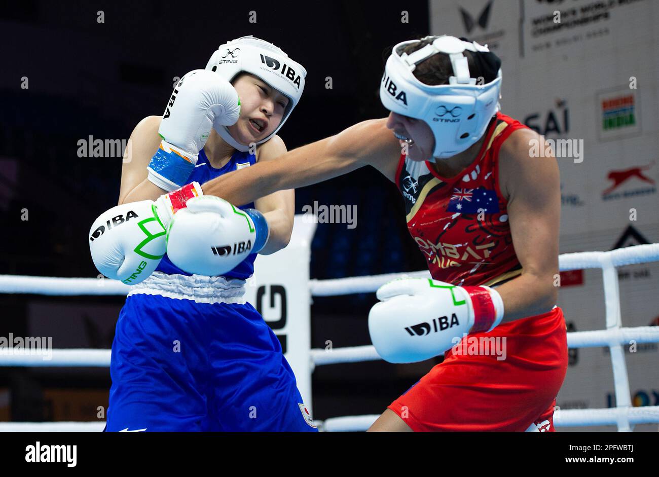 New Delhi, India. 18th Mar, 2023. Japan's Narita Hana (L) competes with ...