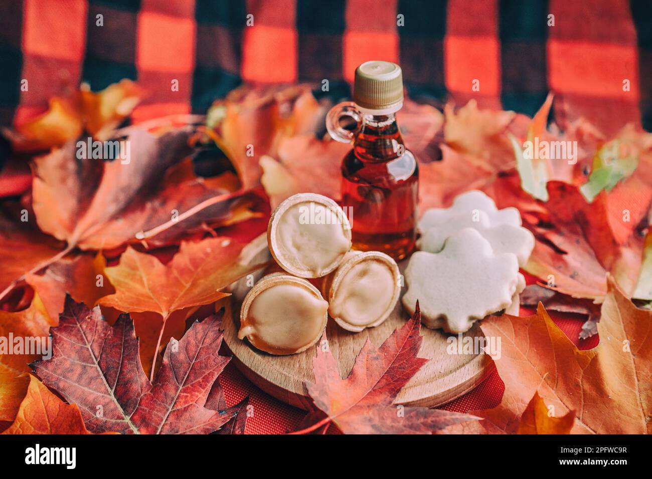 Maple syrup butter and taffy cones with leaf shape cookies on ...