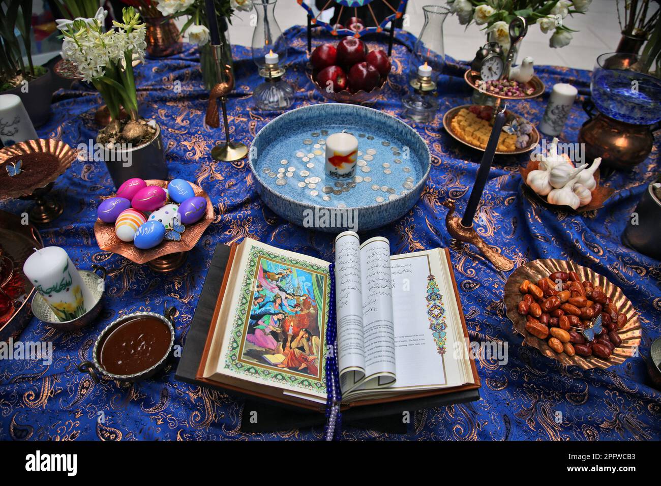 Traditional items adorn a Haft Sin (Haft Seen) (an arrangement of seven ...