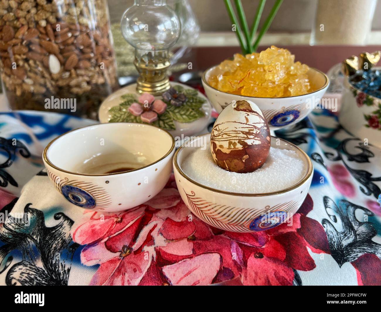 Traditional items adorn a Haft Sin (Haft Seen) (an arrangement of seven ...