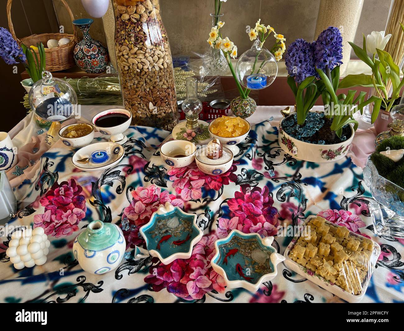 Traditional items adorn a Haft Sin (Haft Seen) (an arrangement of seven ...