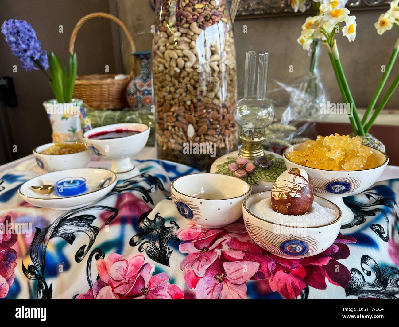 Traditional items adorn a Haft Sin (Haft Seen) (an arrangement of seven ...