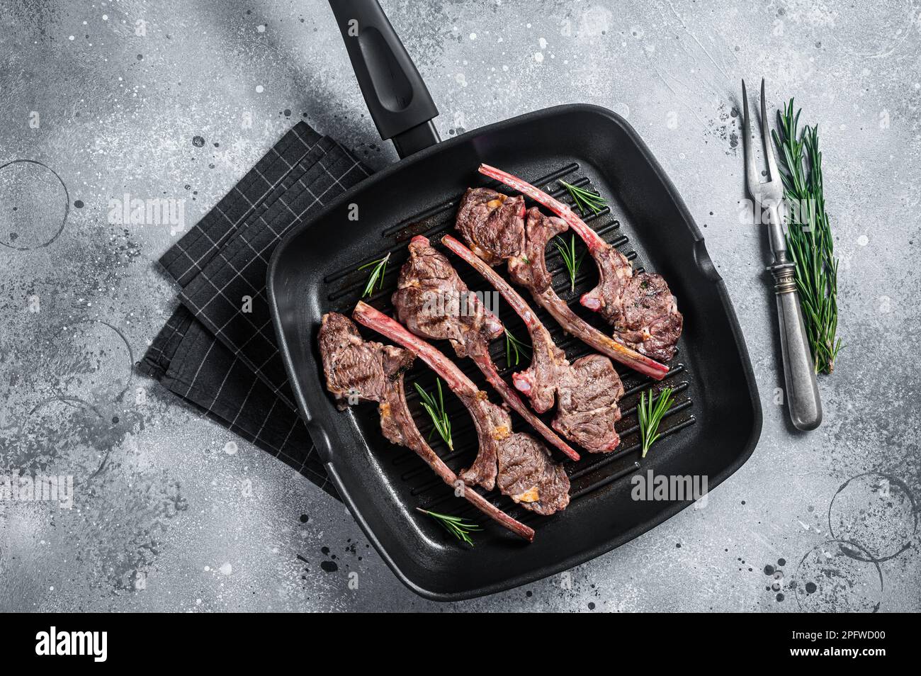 Fried on a grill skillet lamb cutlet steak, mutton rib chop. Gray ...