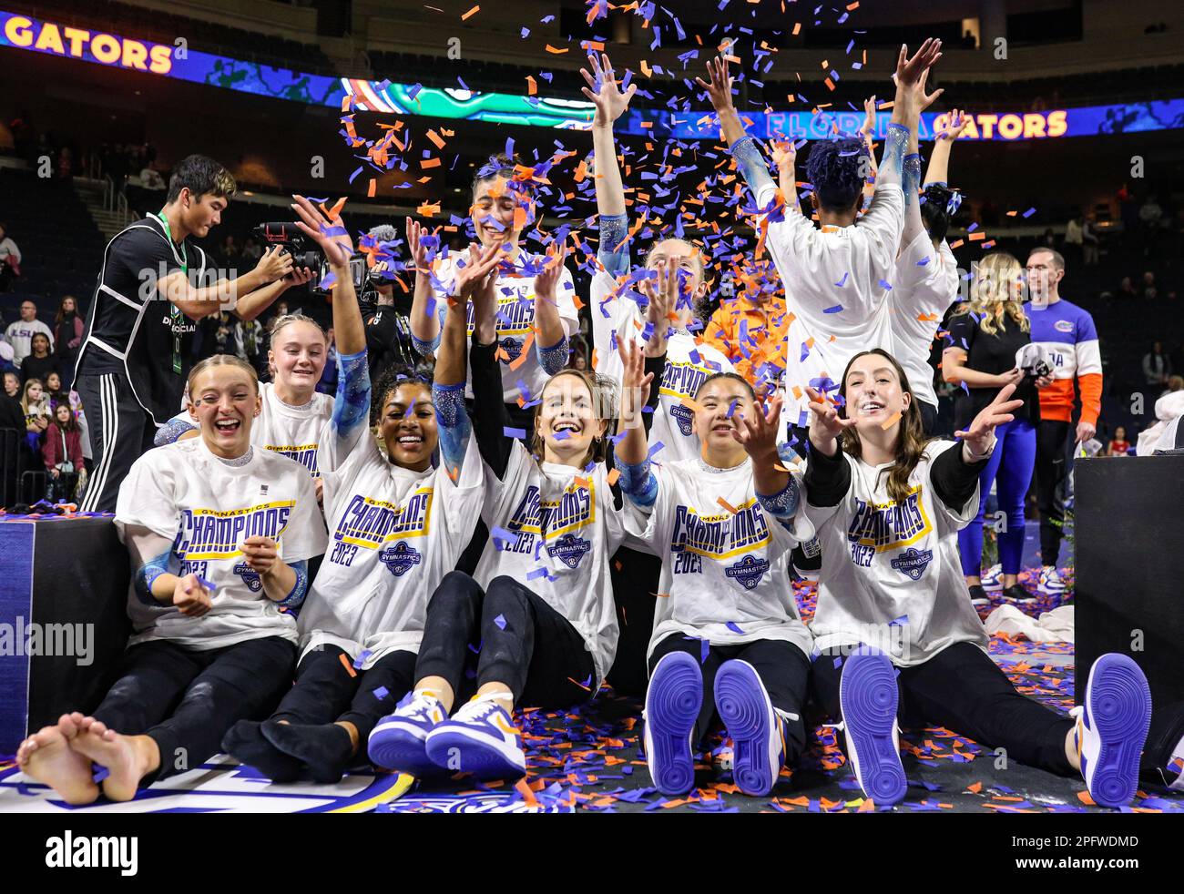 March 18, 2023: The Florida gymnastics team throws up confetti to ...