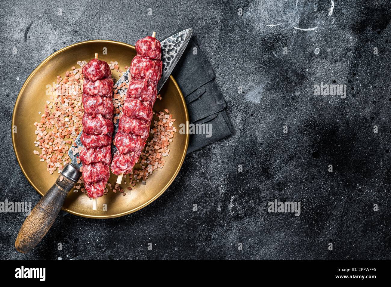 Raw kofta, kofte kebab Skewers with beef and lamb meat and spices ...