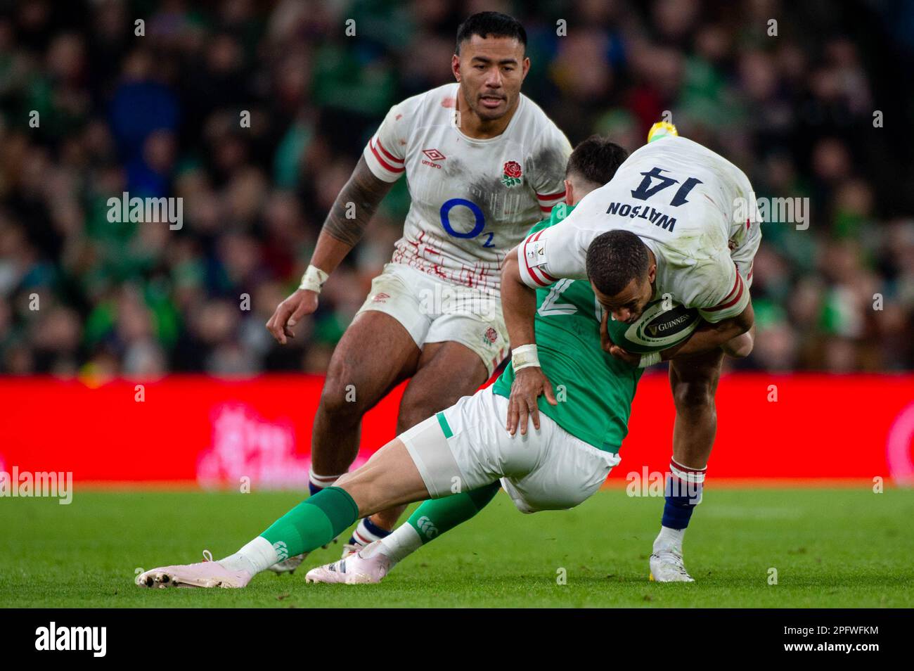 Dublin, Ireland. 19th Mar, 2023. Anthony Watson of England tackled by ...