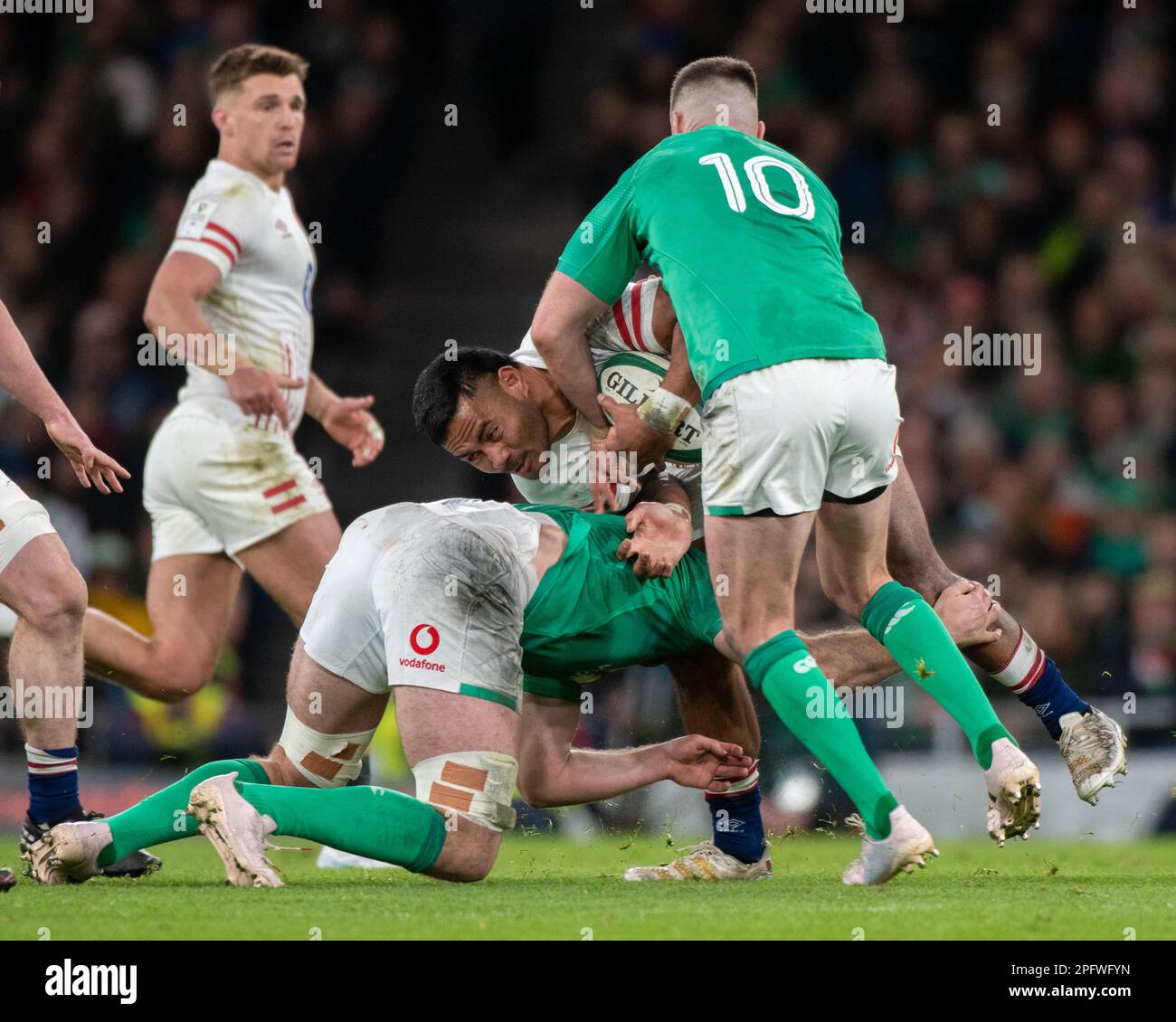 Dublin, Ireland. 19th Mar, 2023. Manu Tuilagi of England tackled by ...