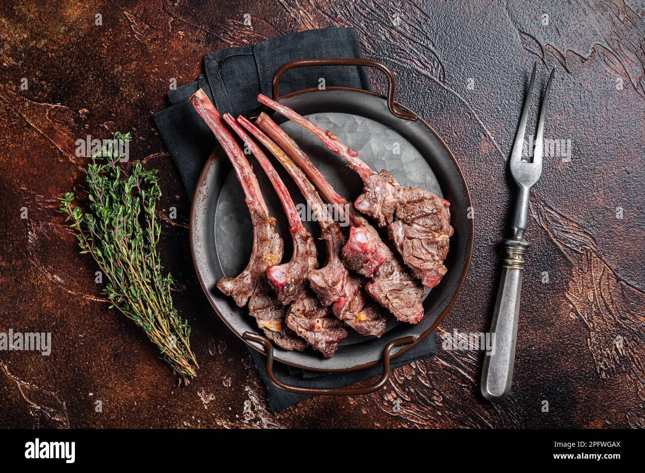 BBQ Grilled lamb chop steak, mutton rib cutlet in steel tray with thyme ...