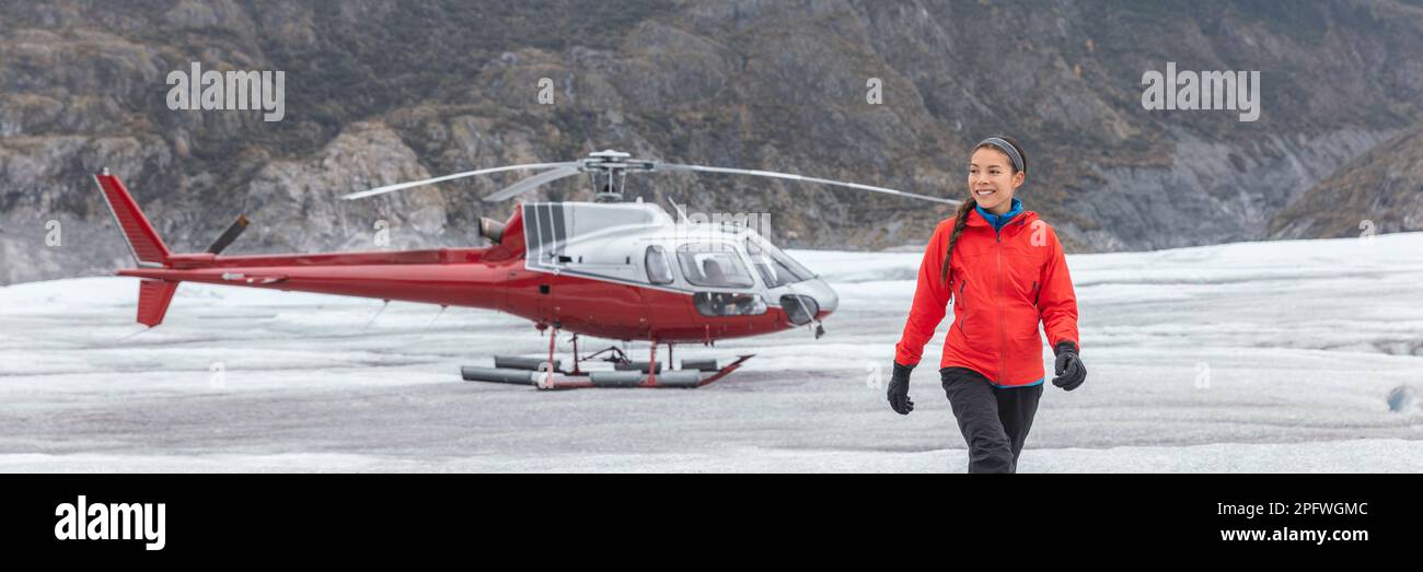 Helicopter pilot woman walking on glacier hiker in Alaska after flying ...
