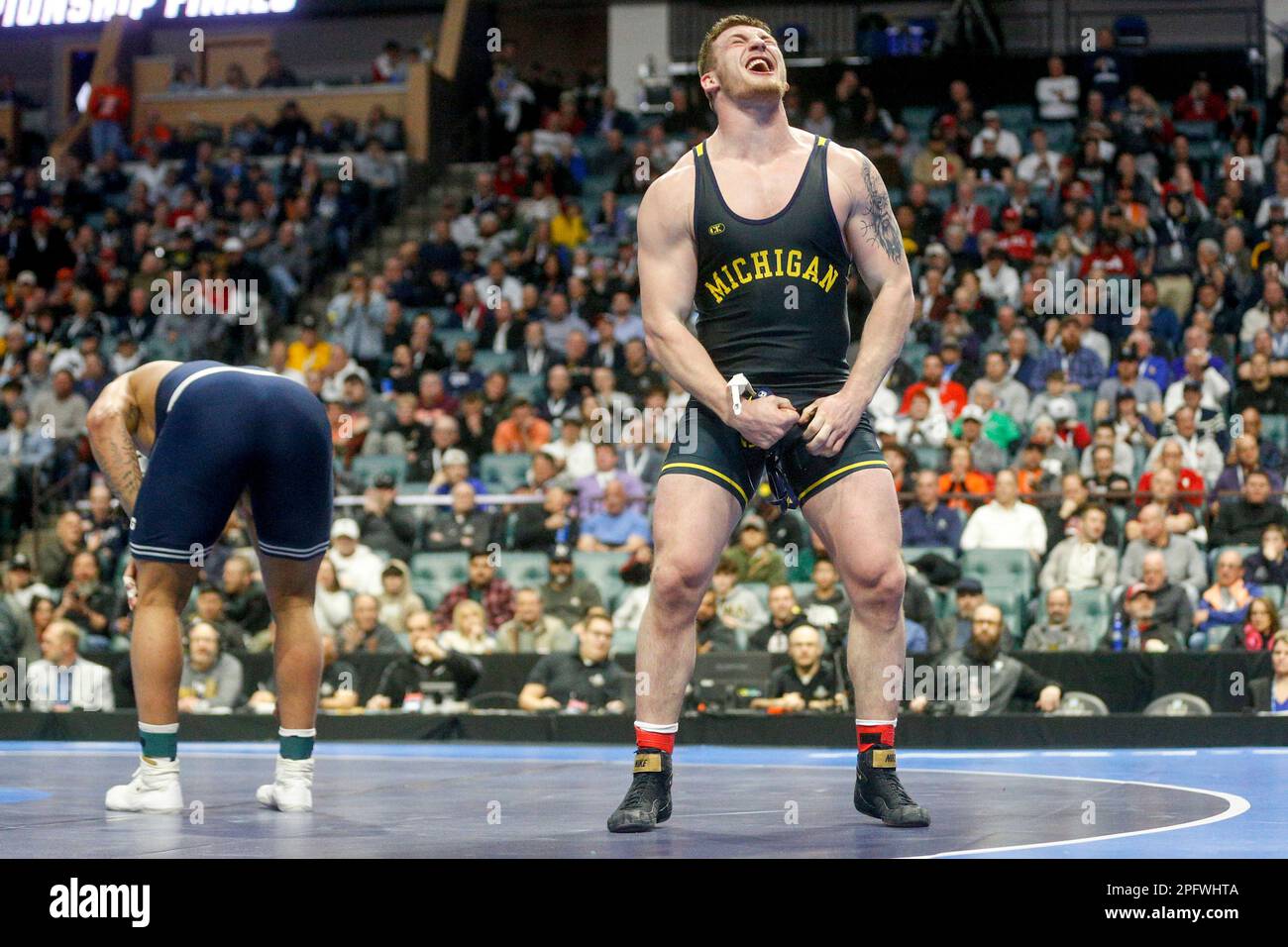 Michigan's Mason Parris celebrates after defeating Penn State's Greg ...