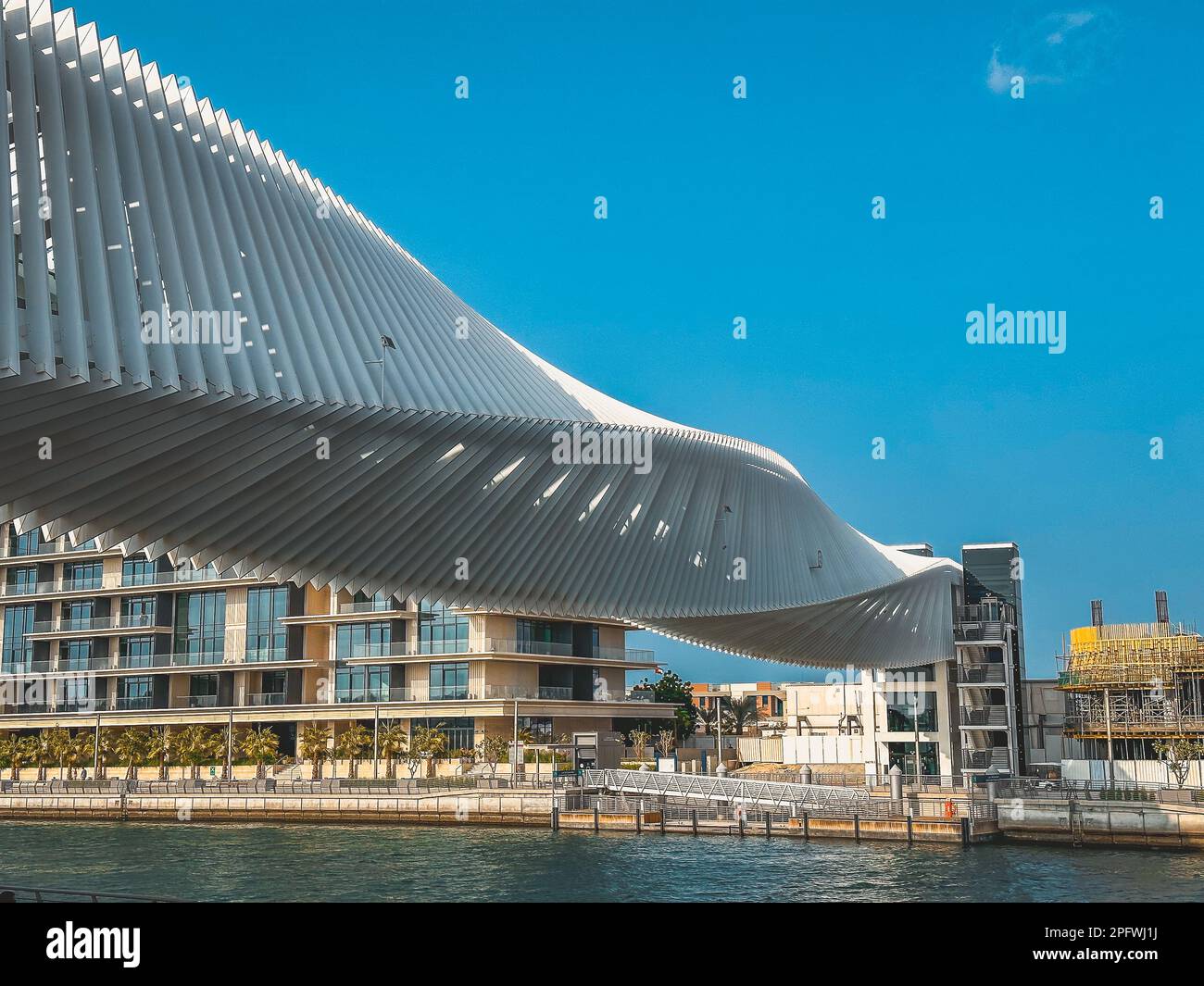Dubai Water Canal Helix Bridge, pedestrian bridge with water taxi, in ...