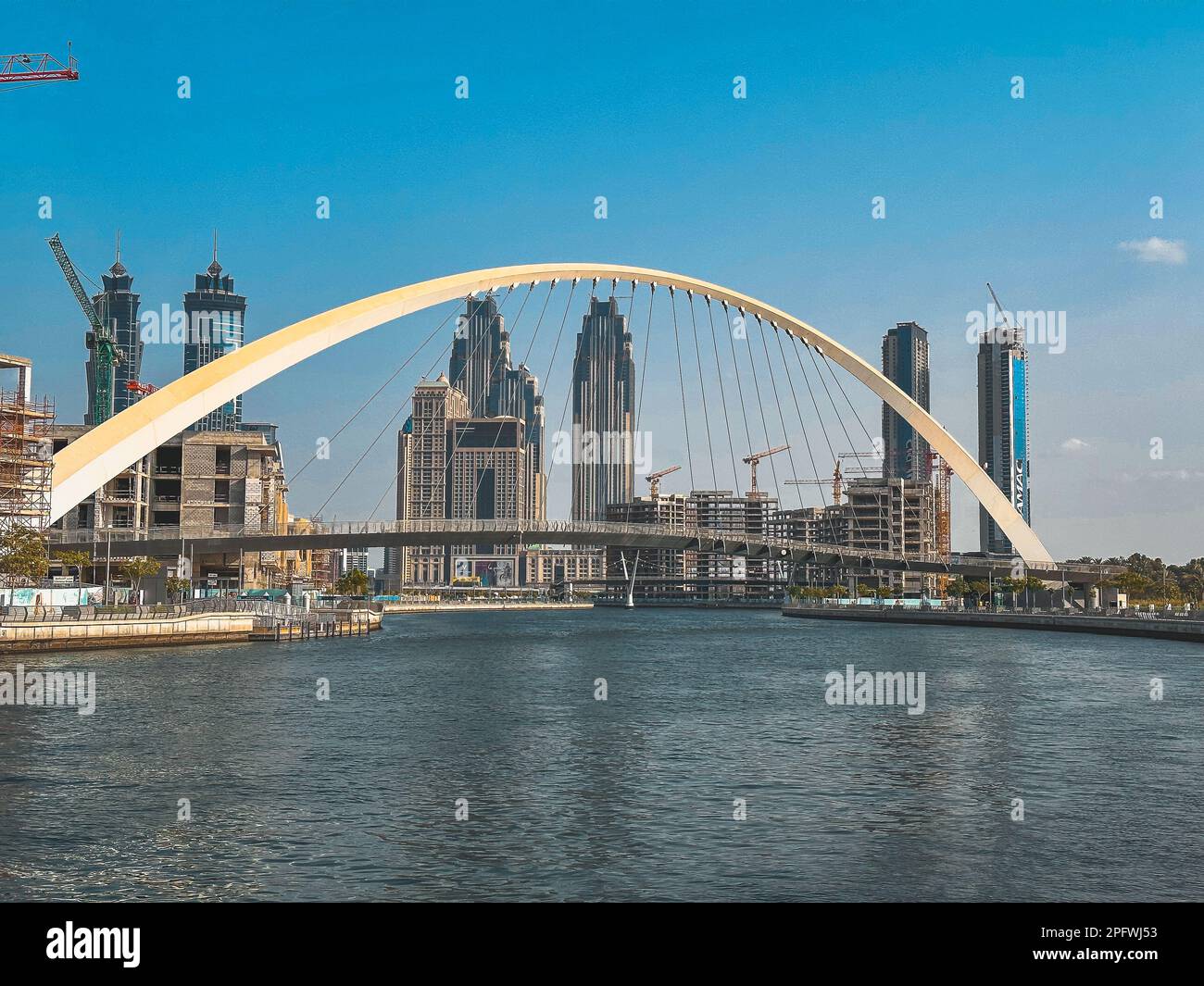 Dubai Water Canal Tolerance Bridge, pedestrian bridge with water taxi ...