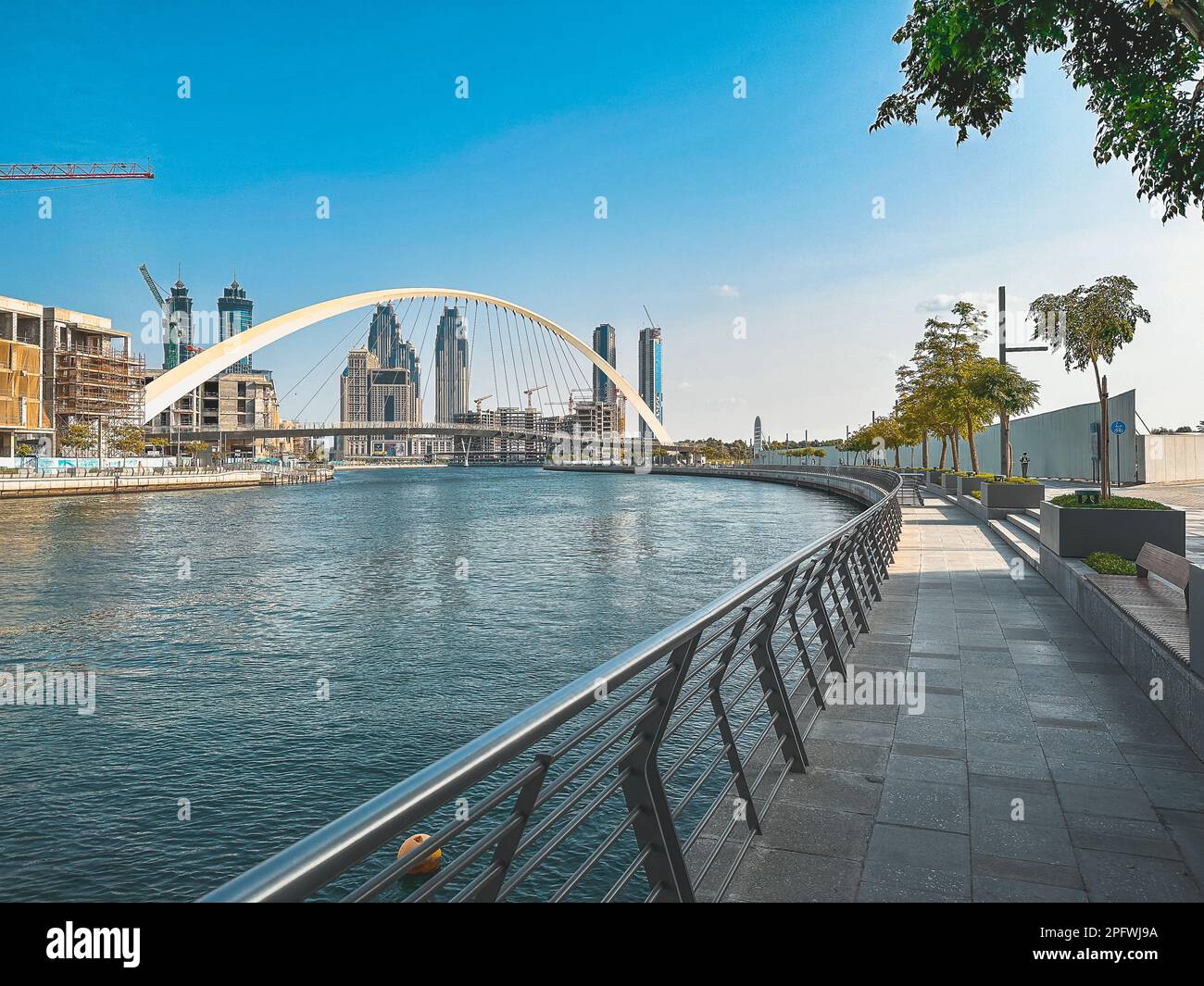 Dubai Water Canal Tolerance Bridge, pedestrian bridge with water taxi ...