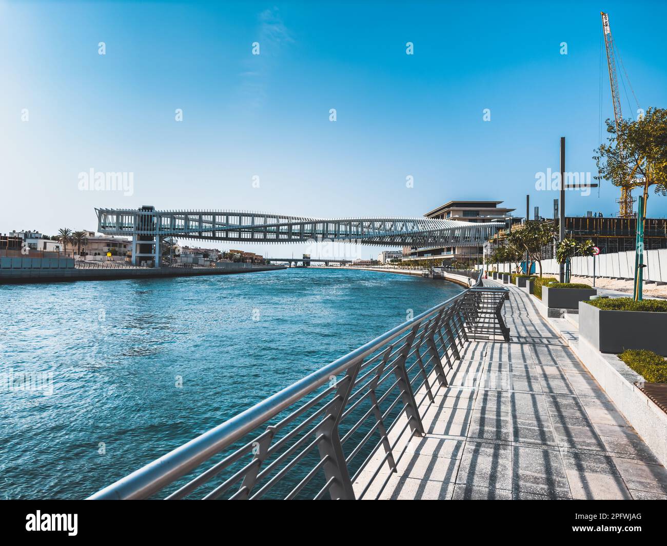 Dubai Water Canal Helix Bridge, pedestrian bridge with water taxi, in ...