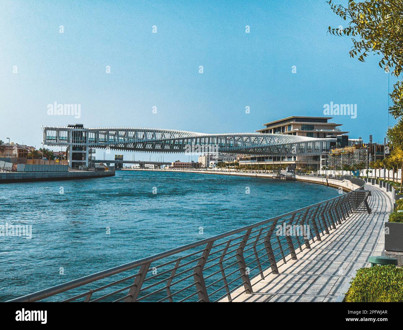Dubai Water Canal Helix Bridge, pedestrian bridge with water taxi, in ...