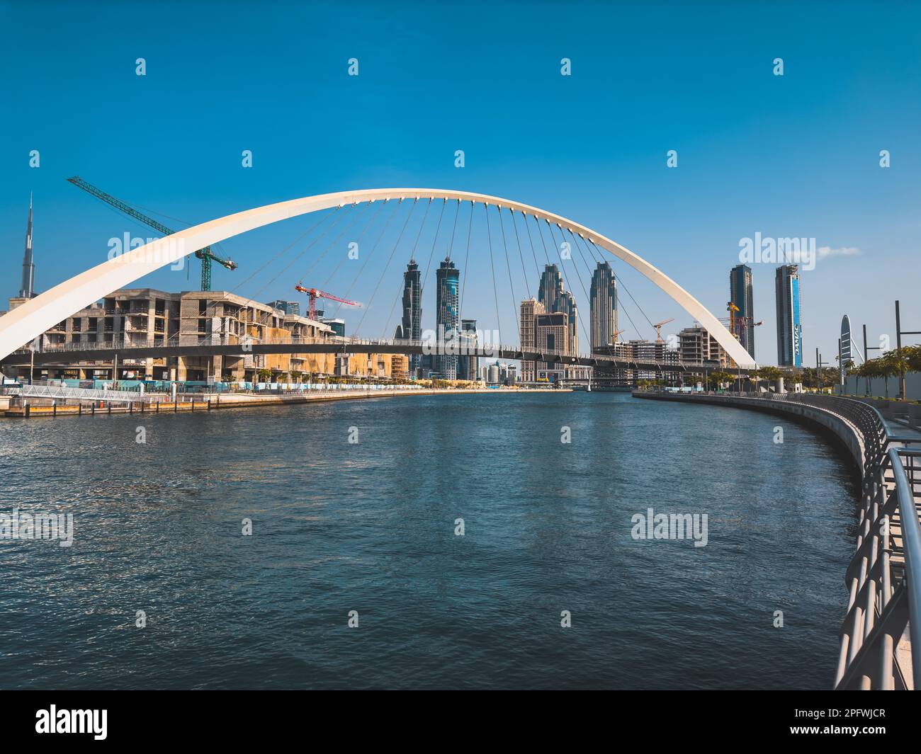 Dubai Water Canal Tolerance Bridge, pedestrian bridge with water taxi ...
