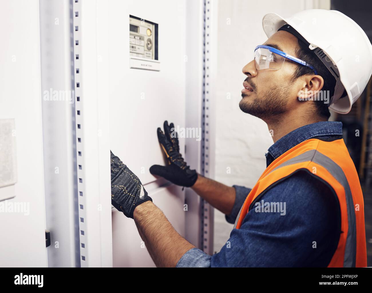 Man, system and technician in control room, power box inspection and ...