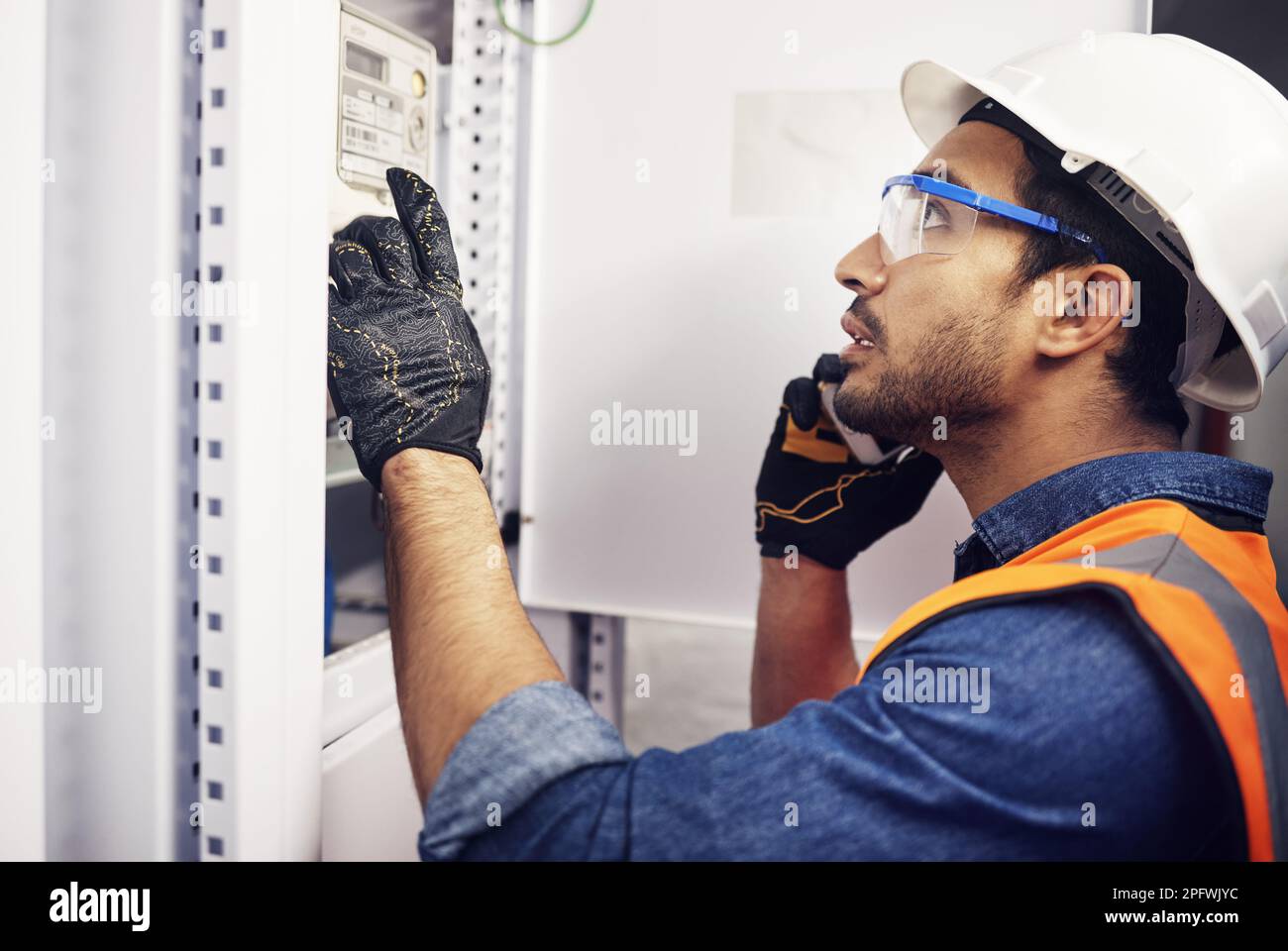 Man, phone call and engineering in control room, switchboard and power ...