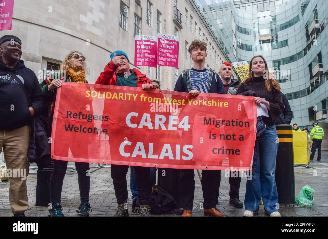 London, UK. 18th Mar, 2023. Protesters hold a Care 4 Calais banner ...