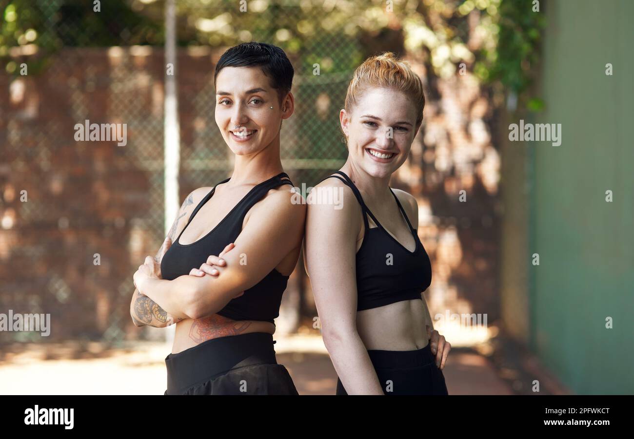Teammates have each others backs. Cropped portrait of two attractive ...