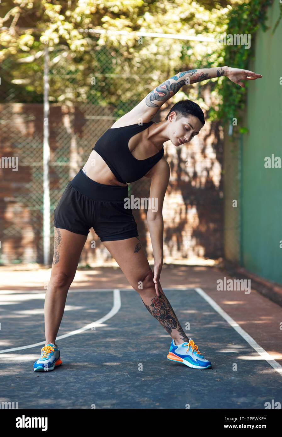 Warming up for the challenge to come. Full length shot of an attractive young female athlete ...