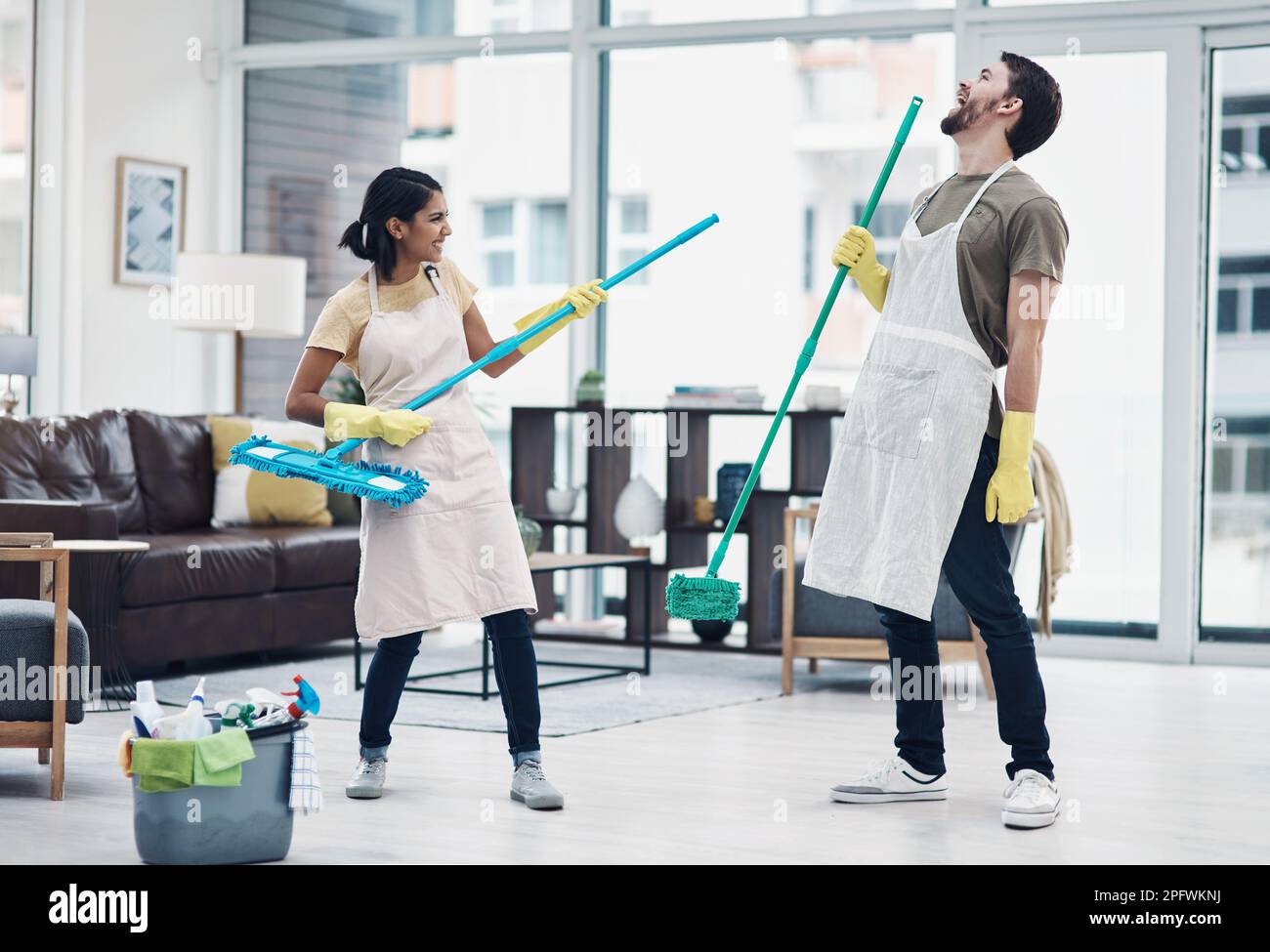 Turn those routine tasks into playtime. a happy young couple having fun ...