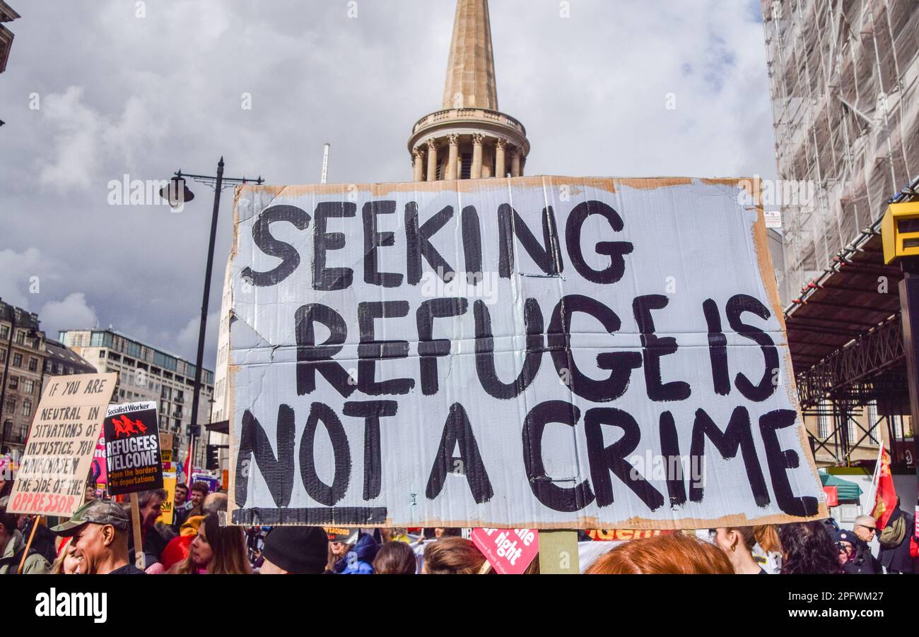 London, UK. 18th Mar, 2023. A placard which states 'Seeking refuge is ...