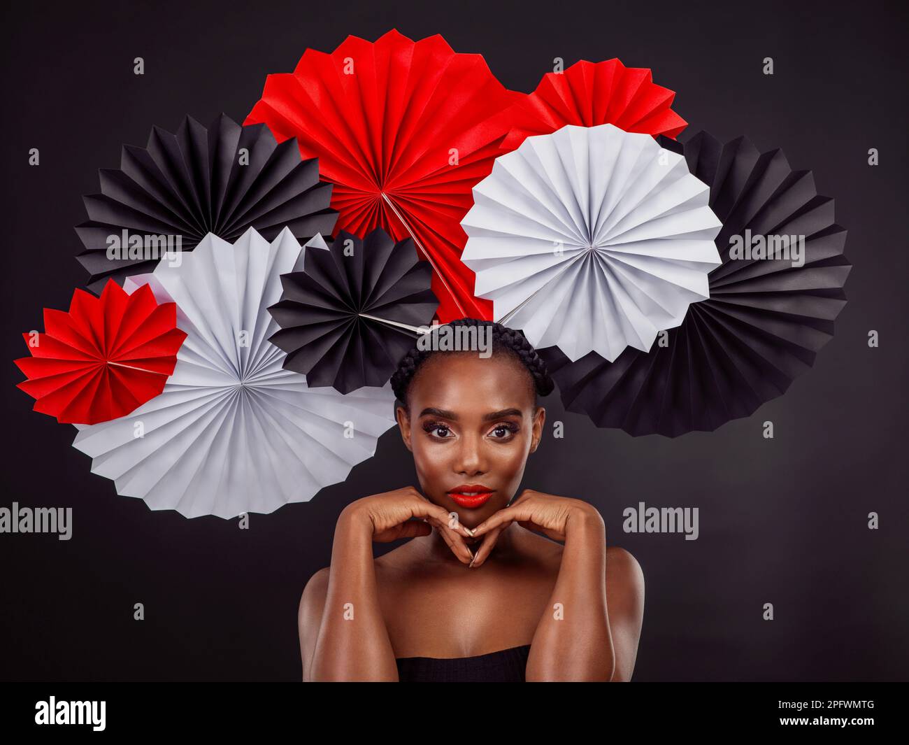 A strikingly beautiful fusion of fashion. Studio shot of a beautiful ...