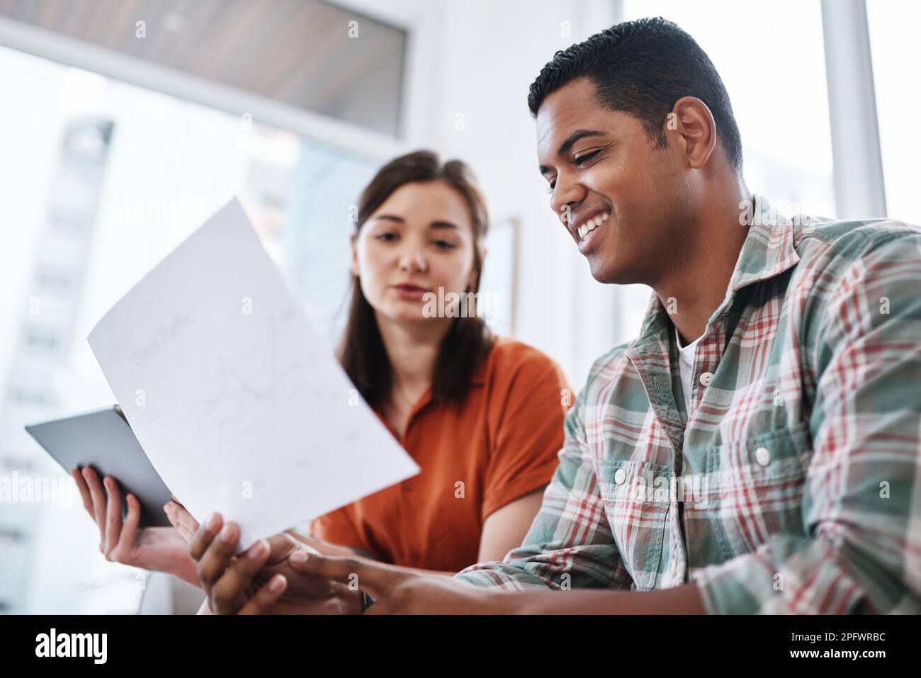 Taking a task from start to finish with teamwork. a young businessman ...