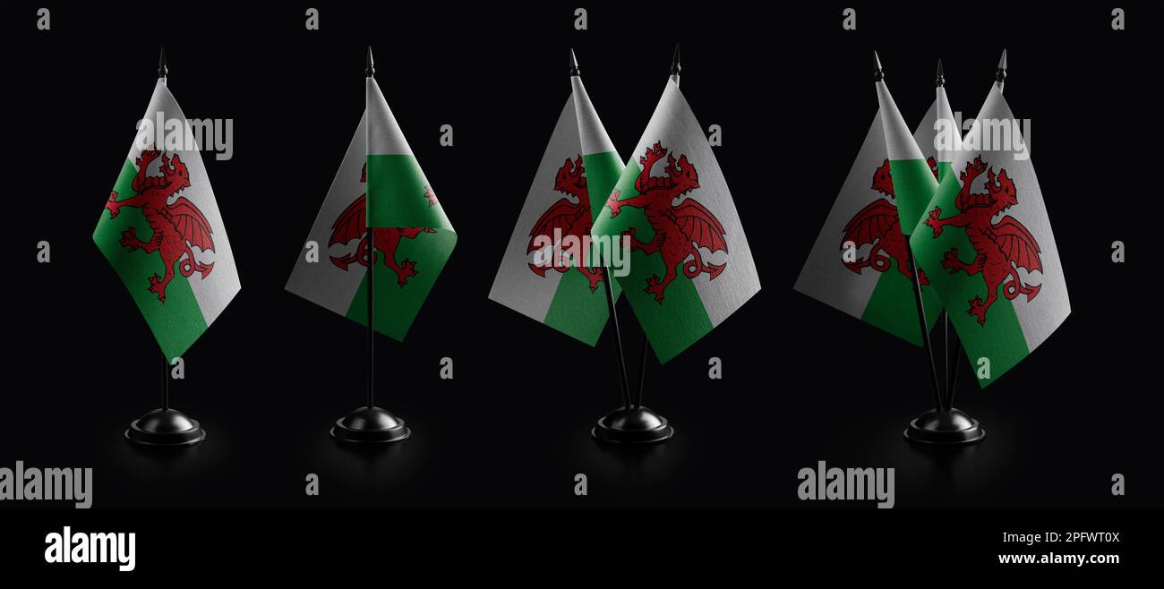 Small national flags of the Wales on a black background Stock Photo - Alamy