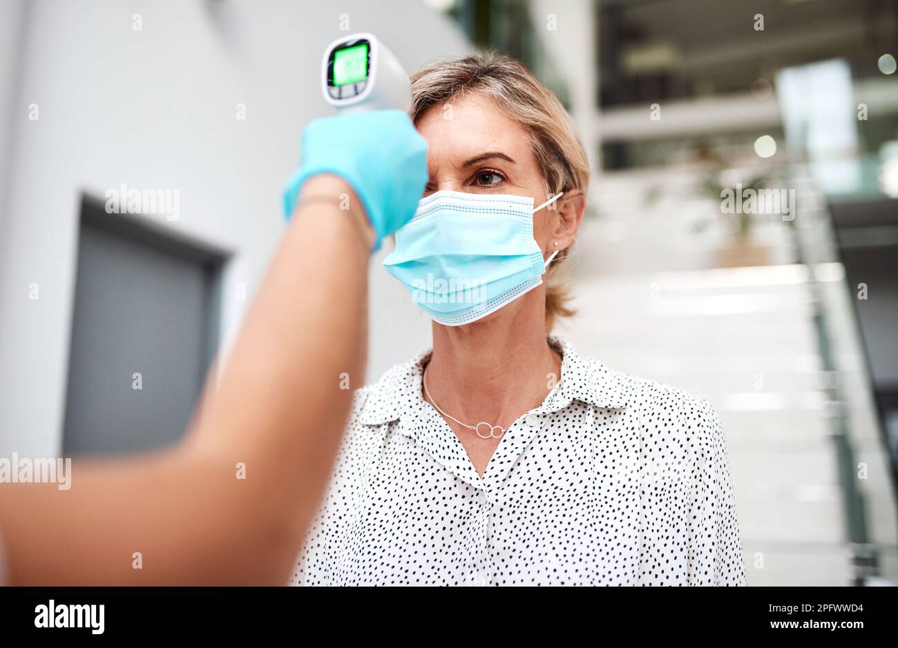 Temperature checks are mandatory for all employees. a mature ...
