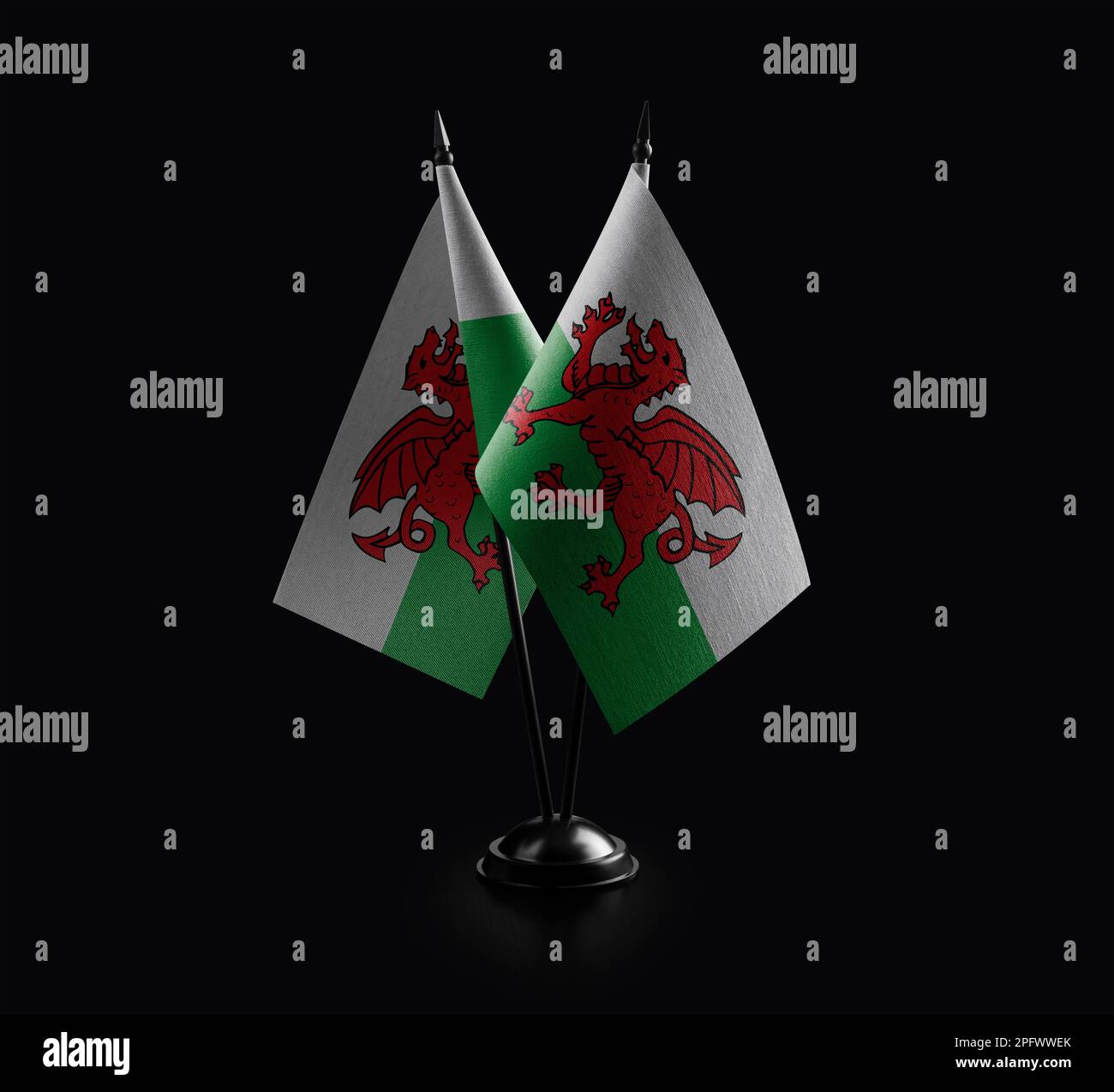 Small national flags of the Wales on a black background Stock Photo - Alamy