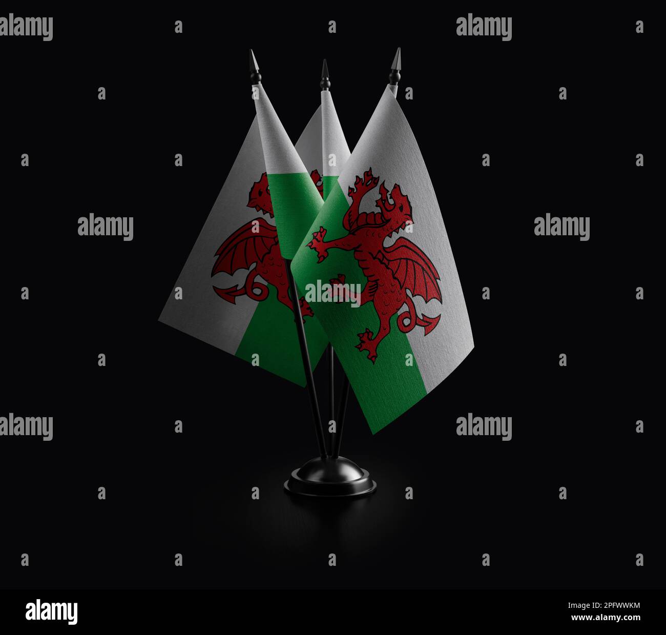 Small national flags of the Wales on a black background Stock Photo - Alamy