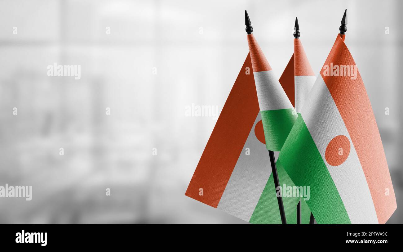Small flags of the Niger on an abstract blurry background Stock Photo ...