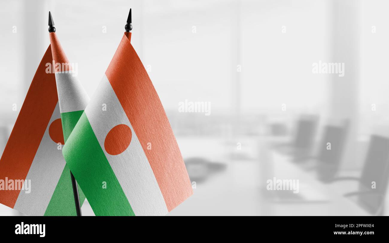 Small flags of the Niger on an abstract blurry background Stock Photo ...