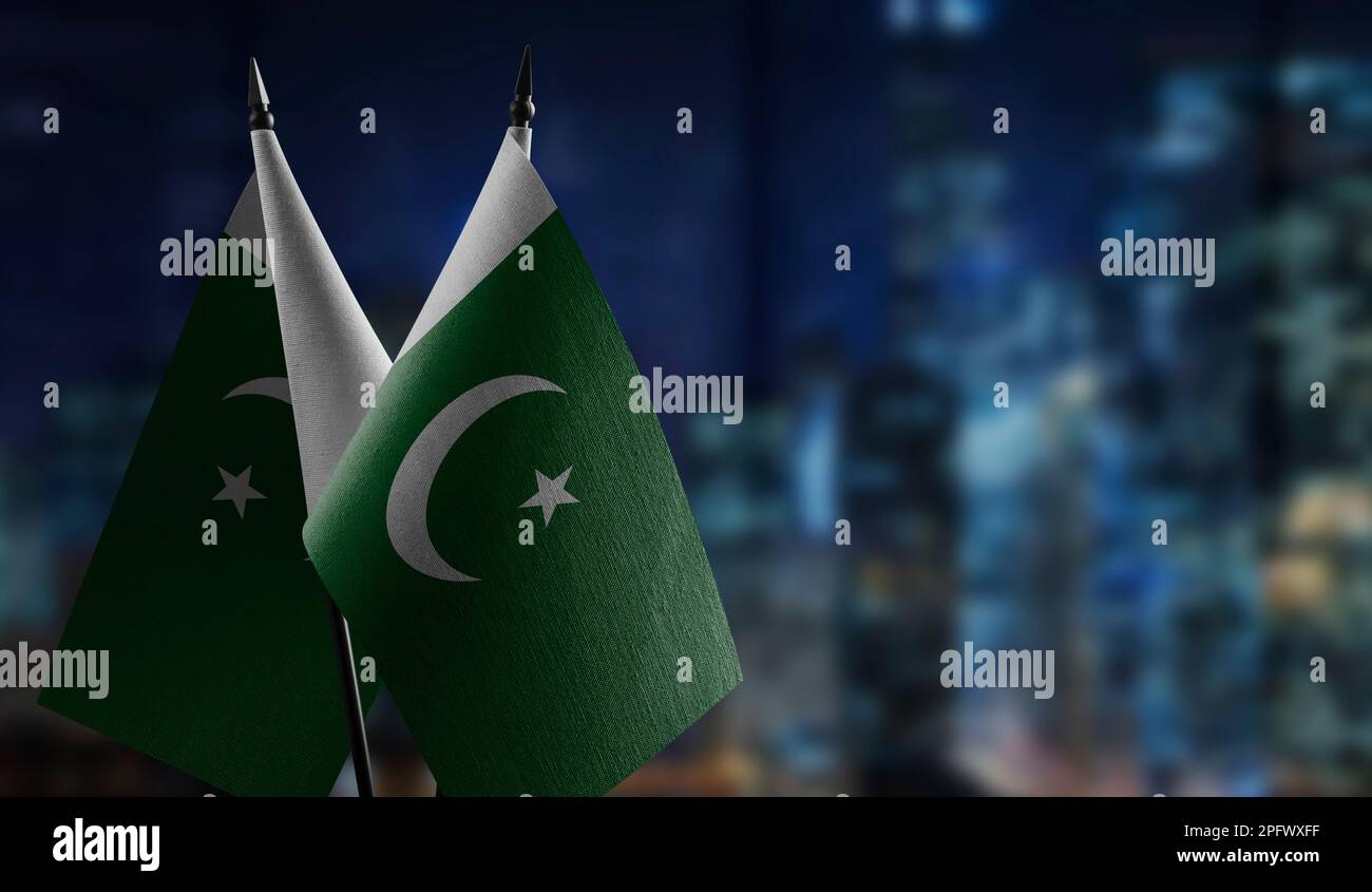 Small flags of the Pakistan on an abstract blurry background Stock ...