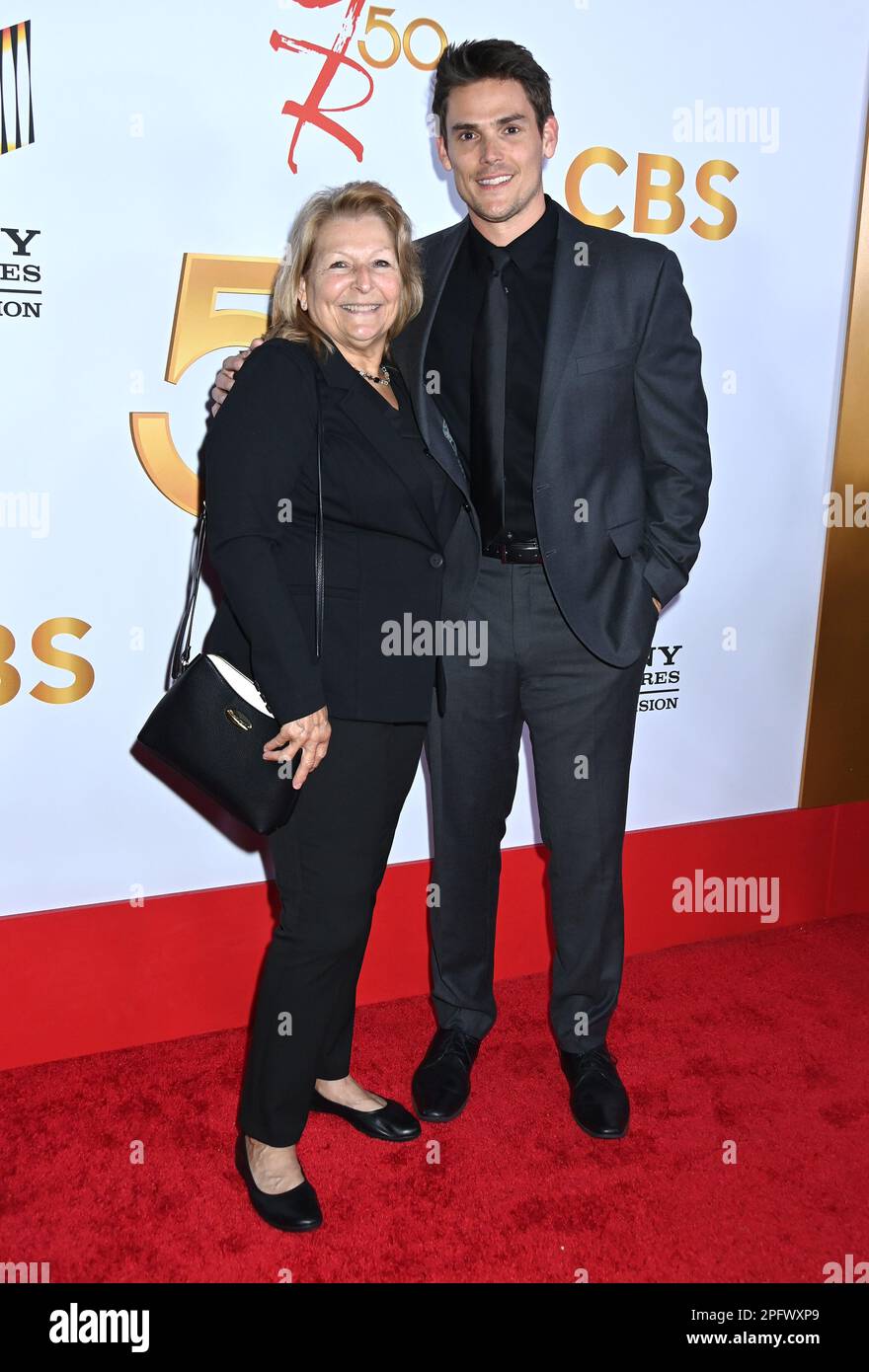 Mark Grossman and Guest arriving at the 50th Anniversary of The Young ...