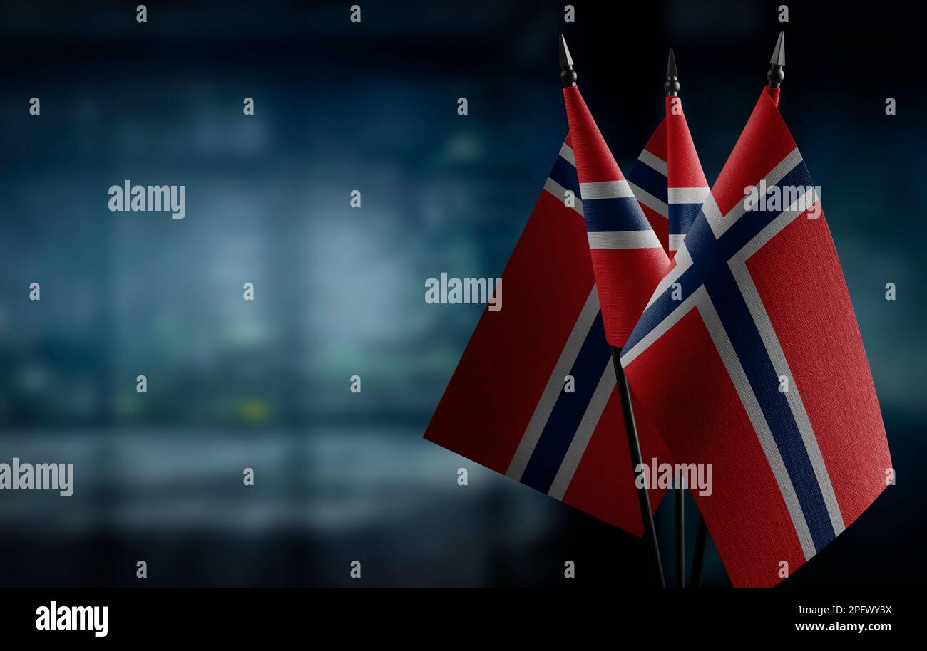 Small flags of the Norway on an abstract blurry background Stock Photo ...