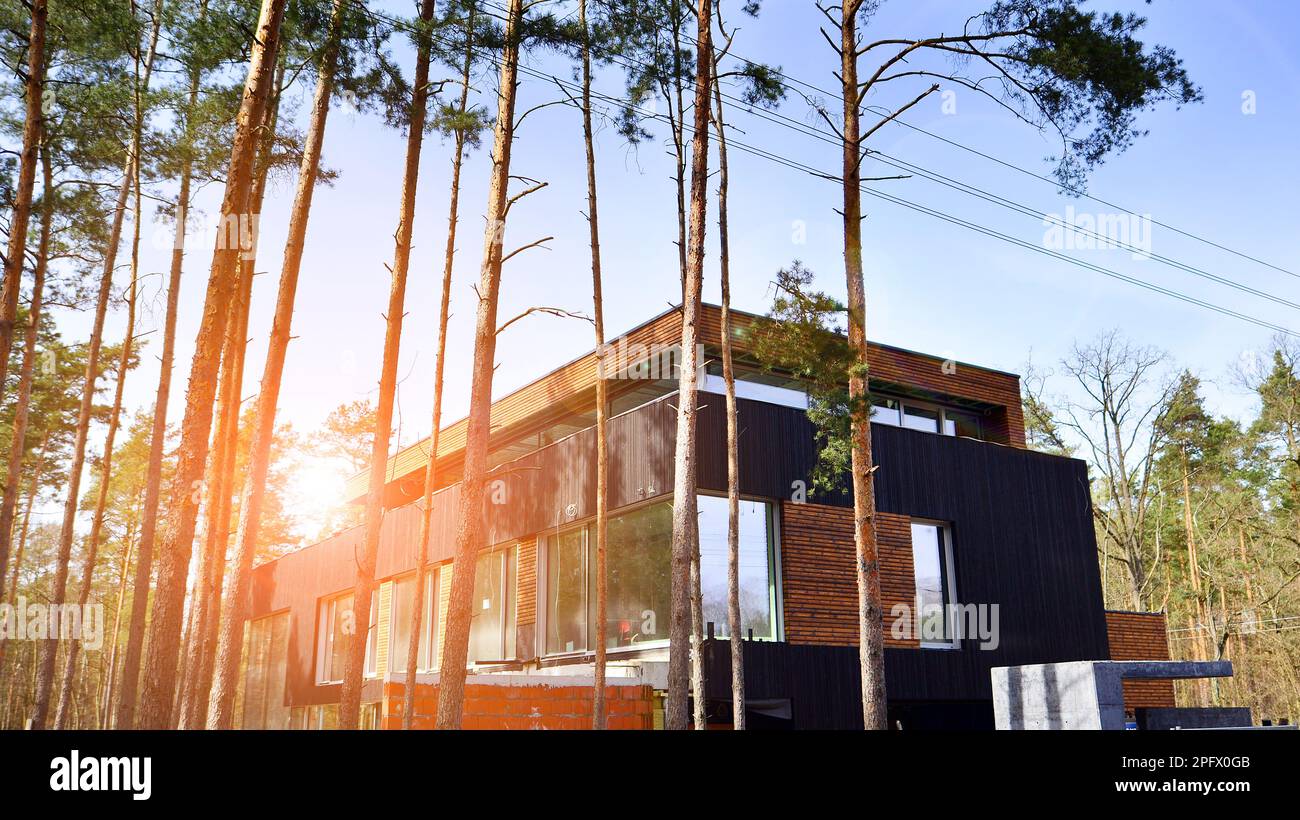 A single-family house under construction in a forest development Stock ...