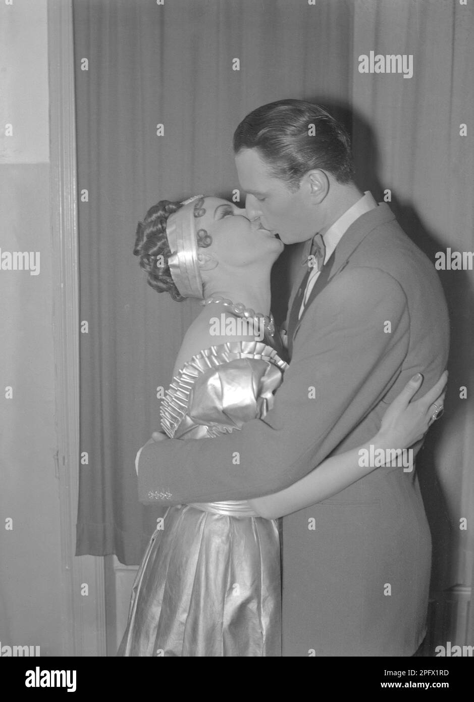Kissing in the 1940s. Actor singer Gustav Wally is seen kissing and ...