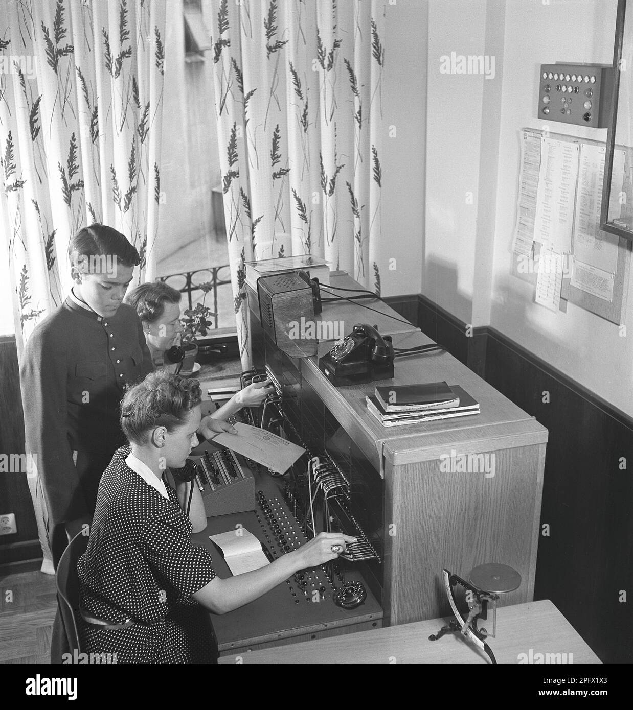 Switchboard in the olden days. Two women work in the company's ...