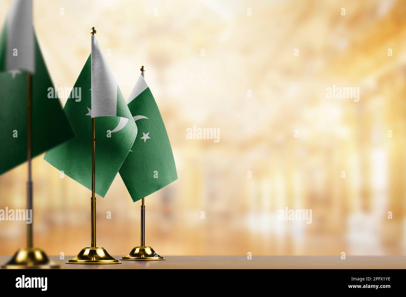 Small flags of the Pakistan on an abstract blurry background Stock ...