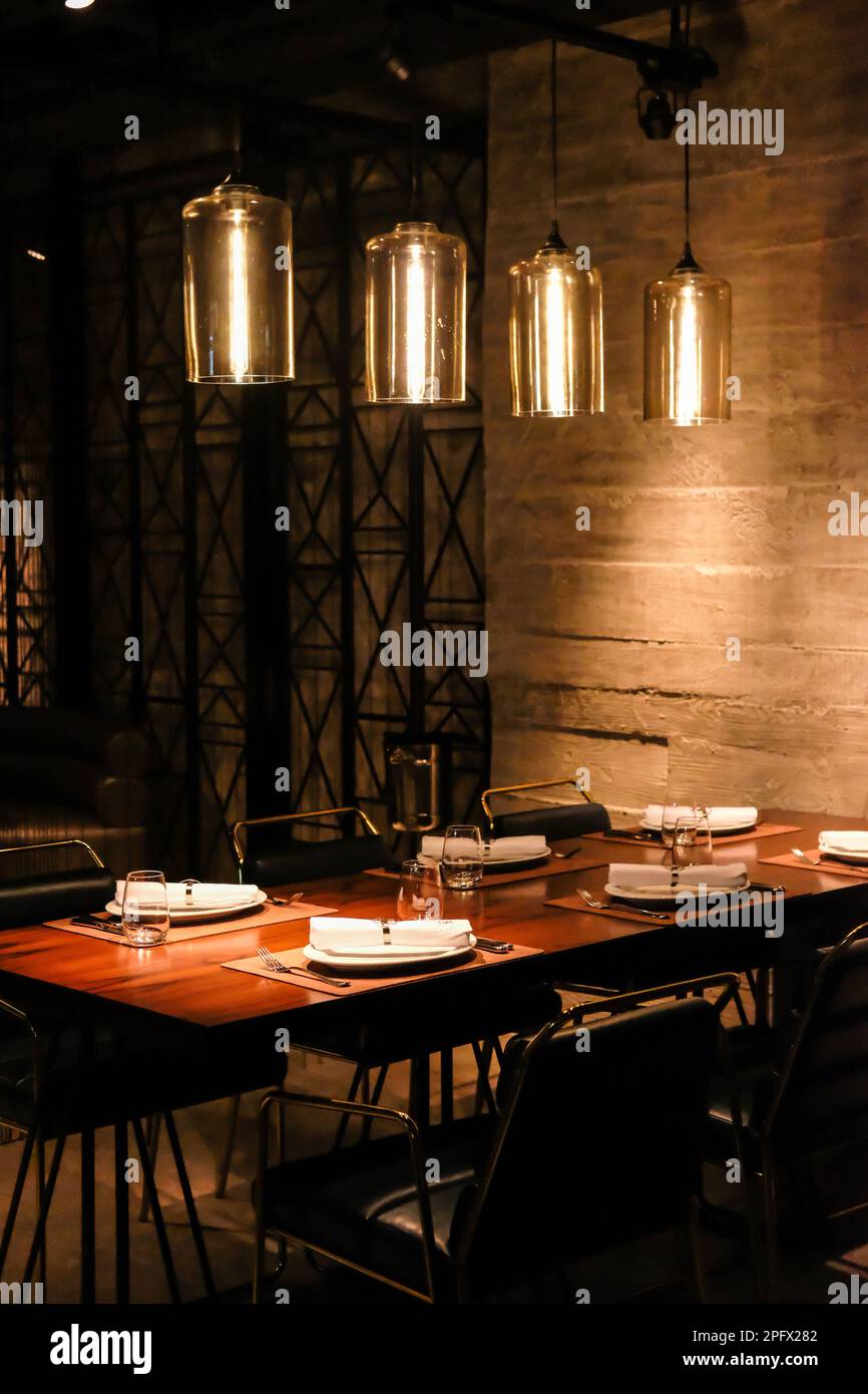 Seating inside the restaurant at night Stock Photo - Alamy