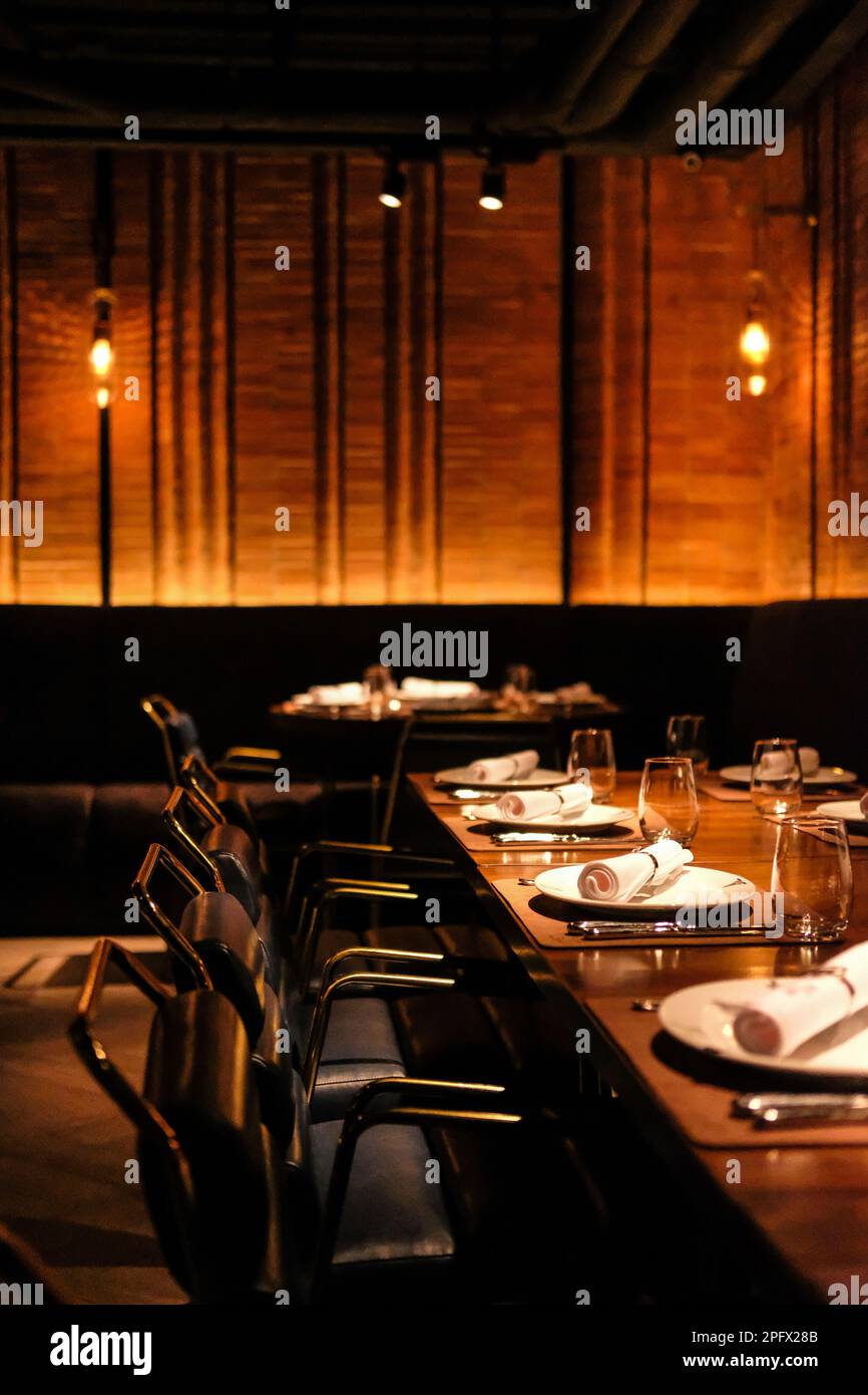 Seating inside the restaurant at night Stock Photo - Alamy