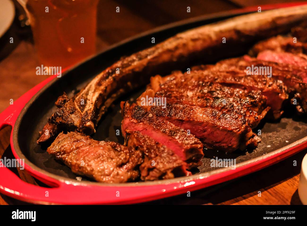 Medium rare meat on plate in the restaurant Stock Photo - Alamy