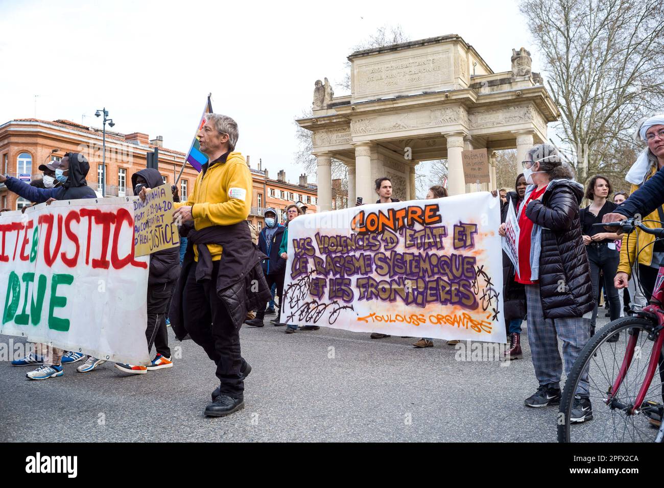 In the procession in front of the war memorial, the banner, Against ...