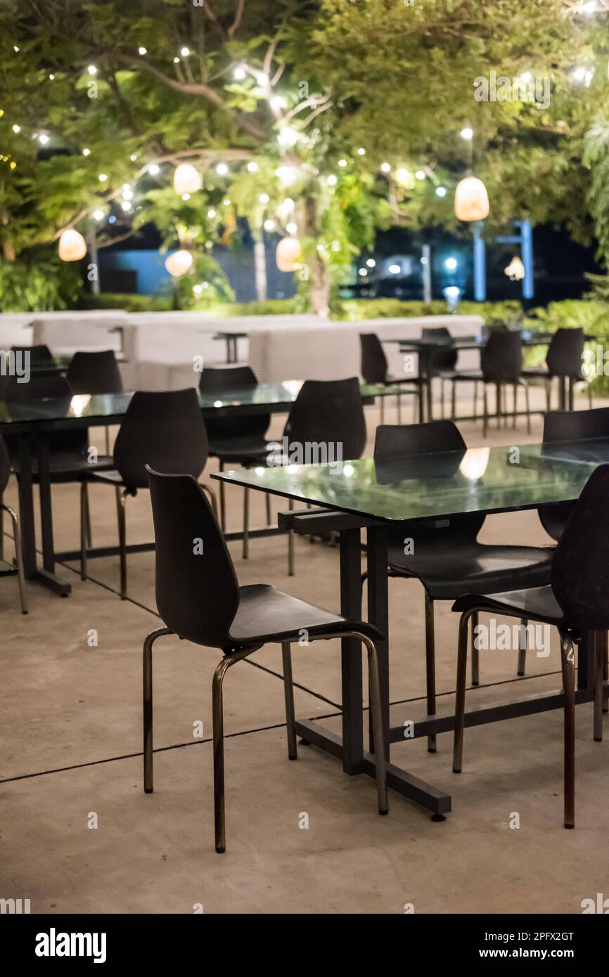 Seating of the outdoor restaurant at night Stock Photo - Alamy