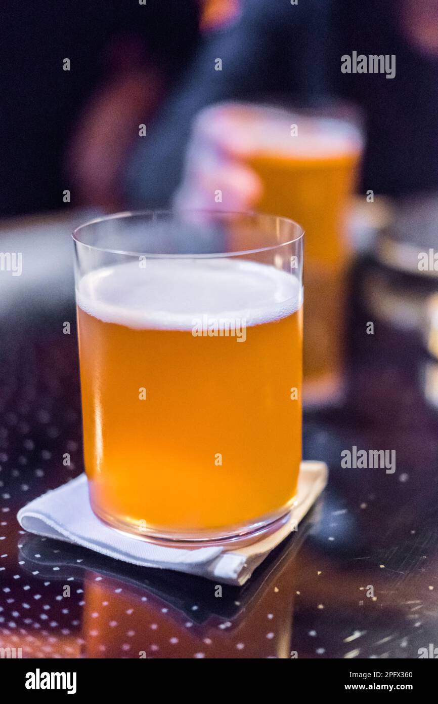 Glass of beer with blur background Stock Photo - Alamy